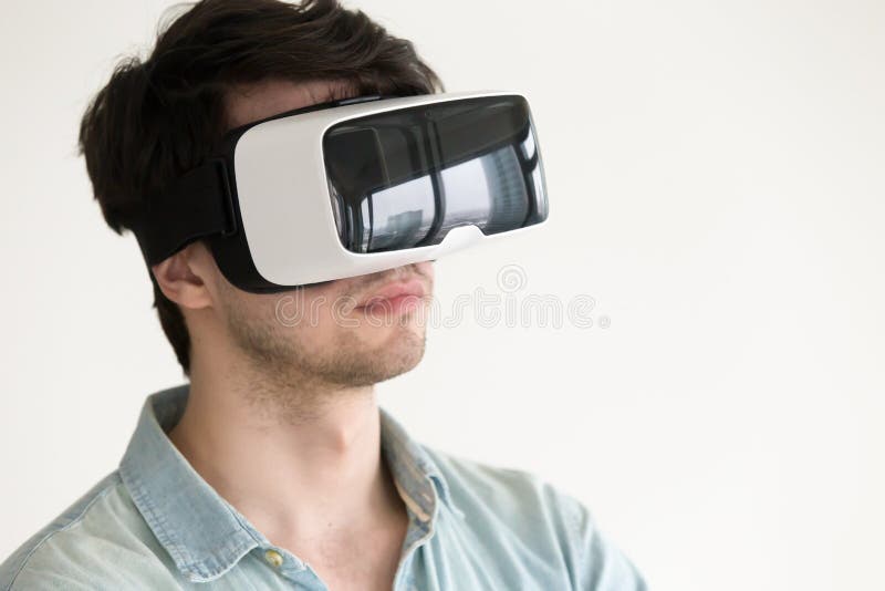 Young Man Using Wearable VR Headset, Trying Virtual Reality Glas Stock ...