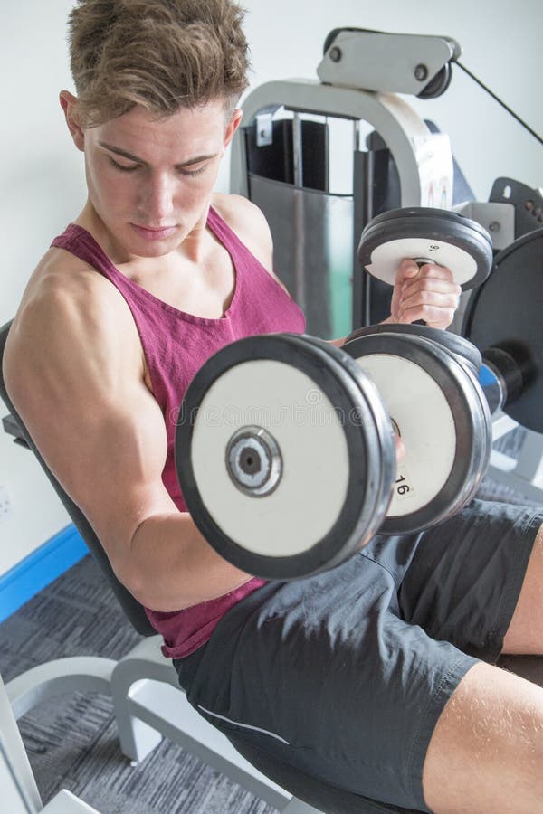 Using dumbbells at home stock image. Image of quiet, standing - 61398837