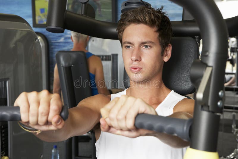 Elevated View of Busy Gym with People Exercising on Machines Stock ...
