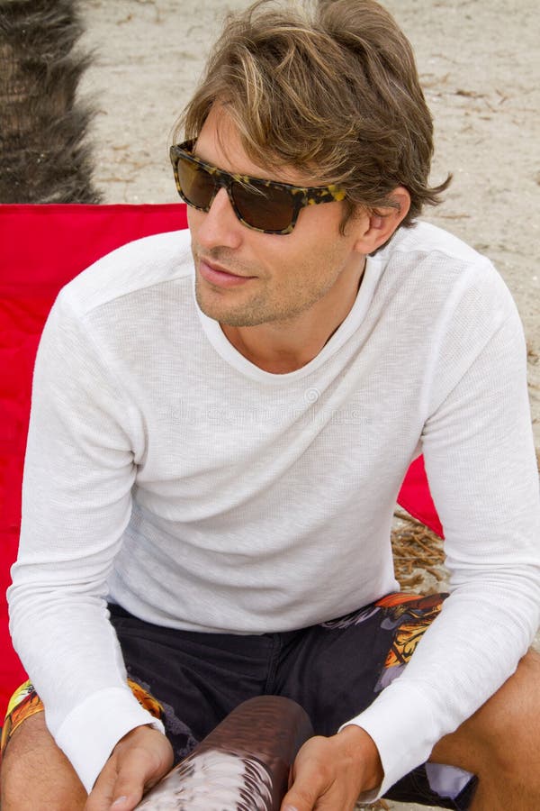 Young Man On Vacation At The Beach Stock Image - Image of brunette ...