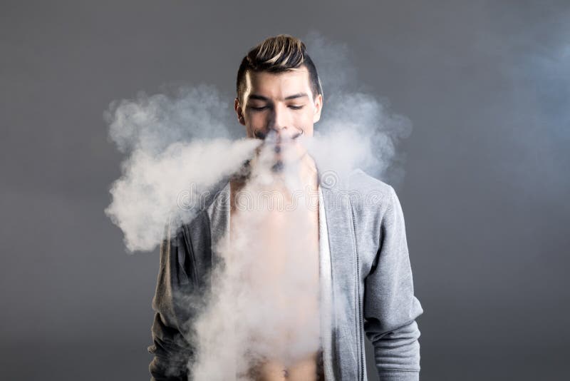 Young man vaping stock photo. Image of serious, adult - 90863382
