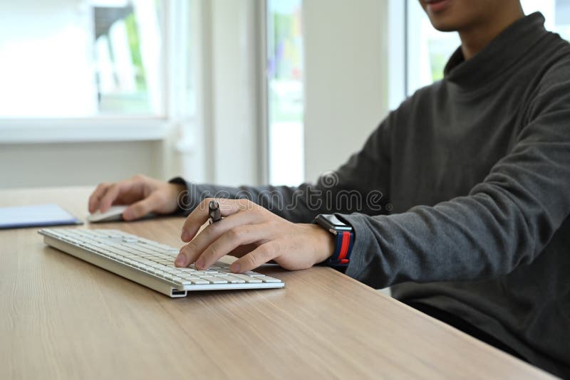 Young Man Video Editor Working with Footage and Post Production Montage ...