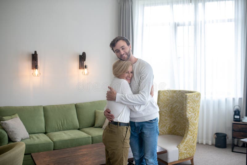 A Young Man Visiting His Mom and Looking Happy Stock Photo - Image of ...