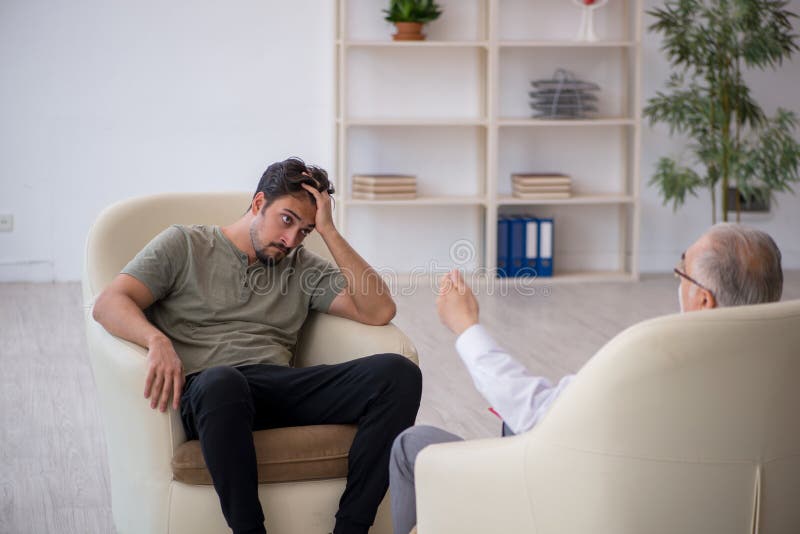 Young Man Visiting Old Psychologist Stock Image - Image of doctor ...