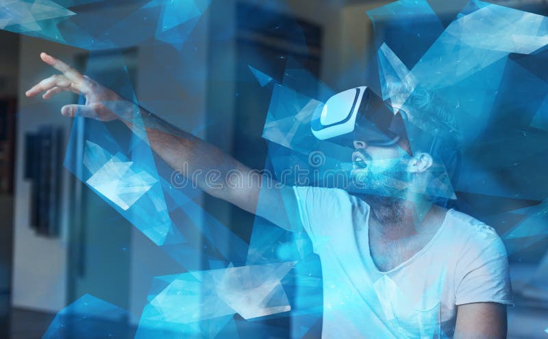 Young Man with VR Glasses Playing Virtual Reality with Blue Glow Stock ...