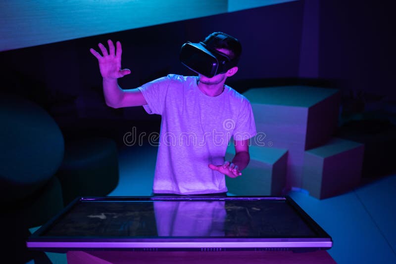 Man with a VR Headset Making Various Hand Movements in the Air Stock ...
