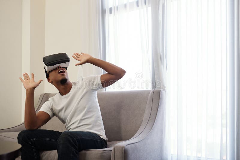 Scared man in VR headset stock photo. Image of modern - 196822004
