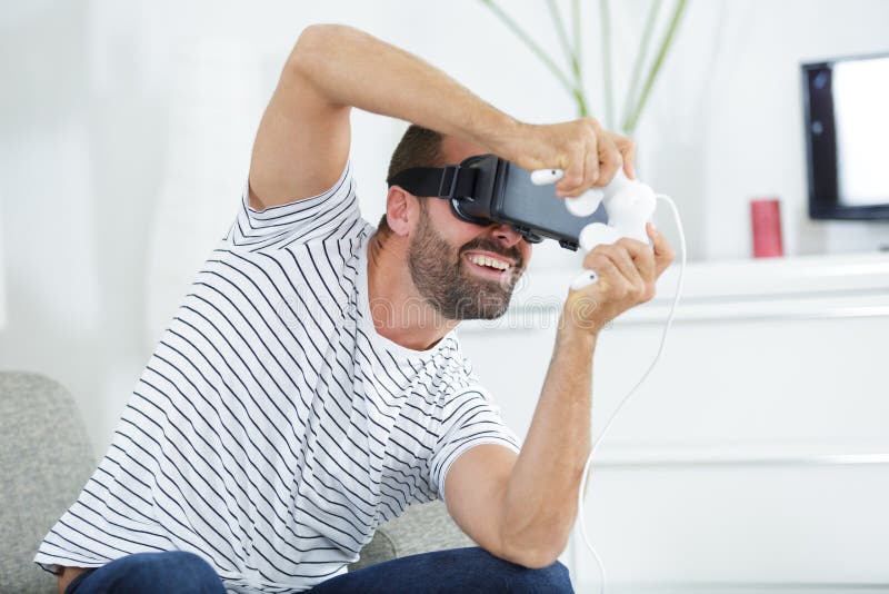 Young Man in Vr Mask Sit on Sofa Stock Image - Image of entertainment ...