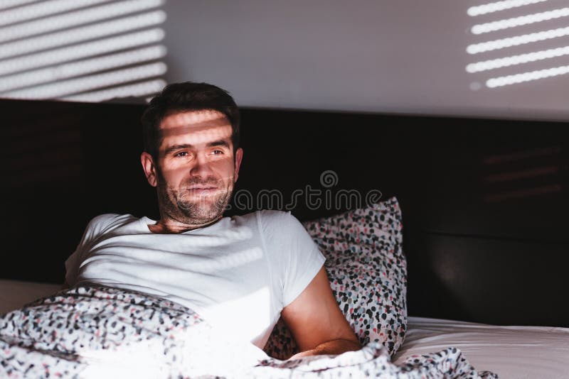 Young Man Waking Up in the Bed Stock Photo - Image of beautiful ...