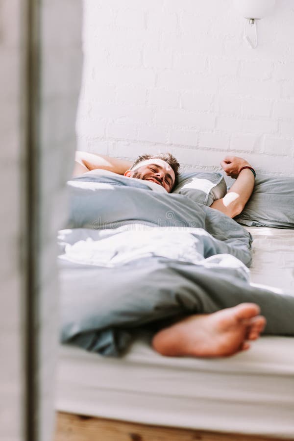 Young Man Waking Up in the Bed Stock Image - Image of male, relax ...