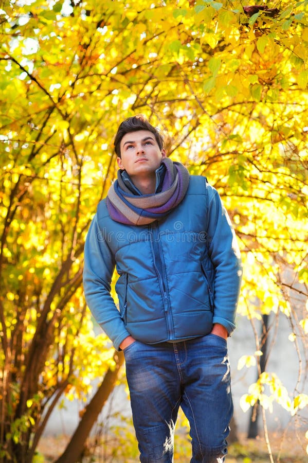 Young man walking in park stock image. Image of face - 32990991