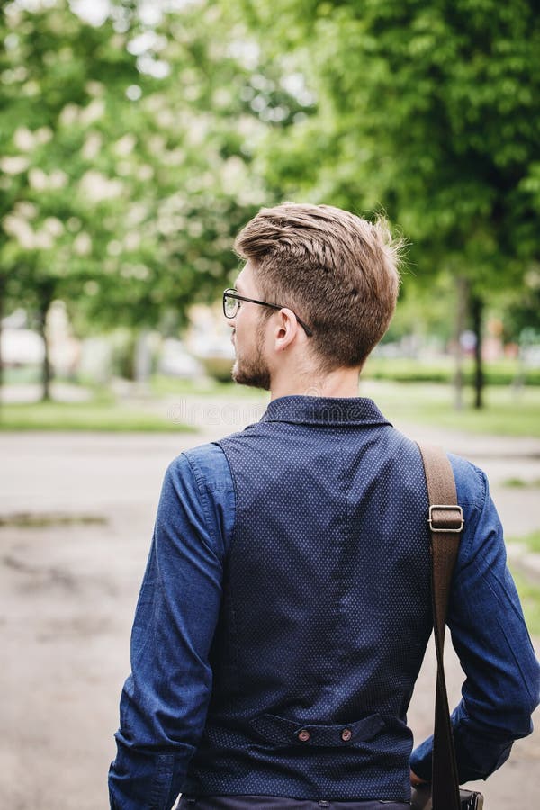 Young Man Walking in the Spring Street Stock Image - Image of columns ...