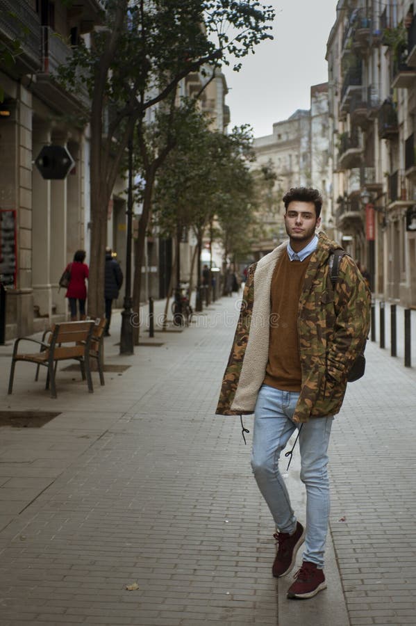 Young Man Walking on the Street Stock Image - Image of outdoors ...