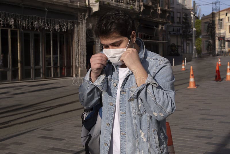 Young Man is Walking on the Street with a Protective Mask Stock Image ...