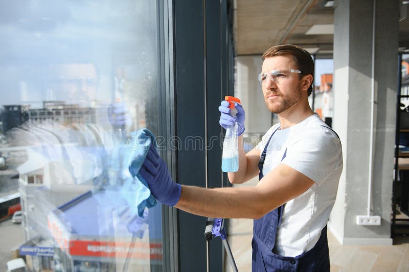 Young Man Washing Window in Office Stock Image - Image of housekeeping ...