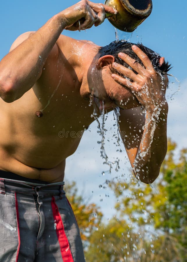 Young man is washing stock photo. Image of outside, male - 200423230