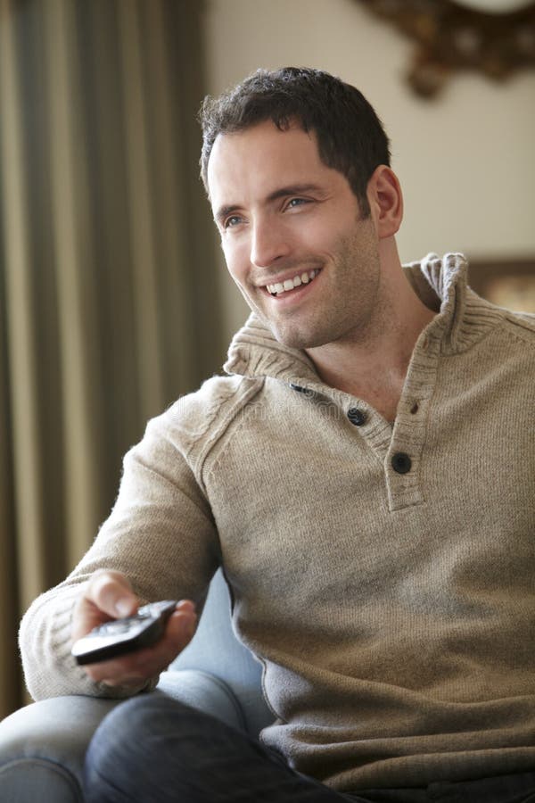 Young Man Watching Television at Home Stock Image - Image of enjoying ...
