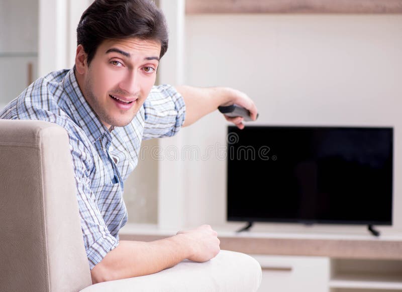 Young Man Watching Tv at Home Stock Photo - Image of channels, cinema ...