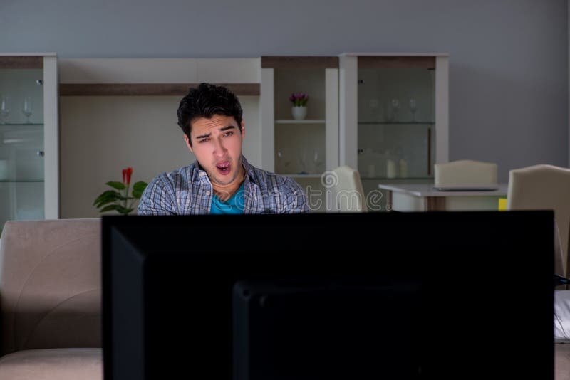 The Young Man Watching Tv Late at Night Stock Image - Image of couch ...