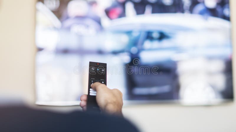 Young Man Watching Video on Demand on Her TV Stock Photo - Image of ...