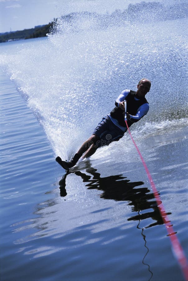 A young man water skiing stock image. Image of colour - 6077835