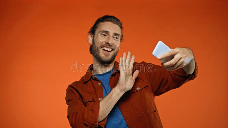 Young Man Waving Hand while Having Stock Image - Image of device ...