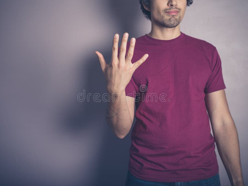 Young man waving his hand stock photo. Image of sign - 59294930
