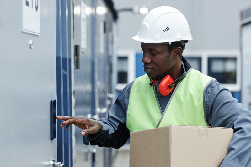 Young Man Wearing Hardhat in Storage Stock Photo - Image of ...