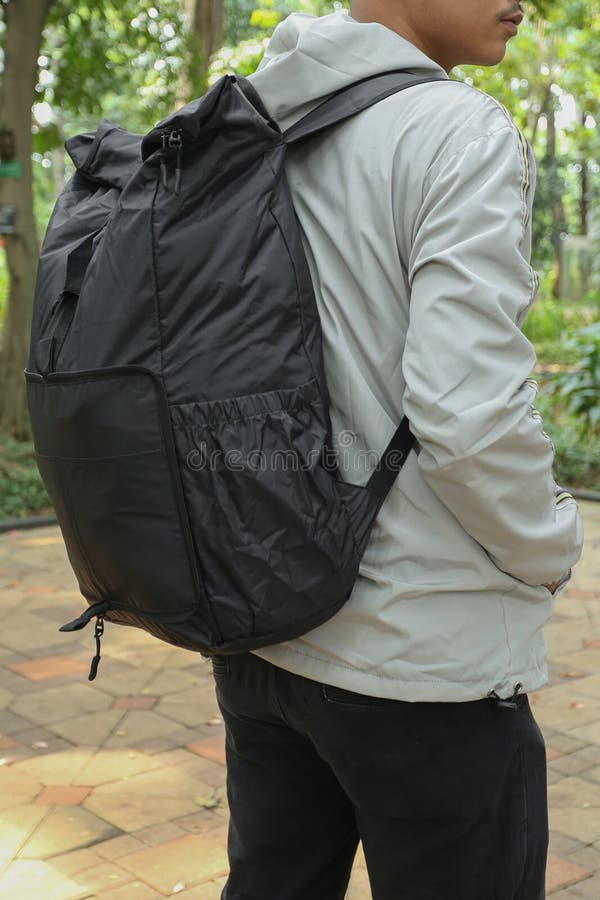 Young Man Wearing a Hoodie Jacket and Black Backpack Stock Photo - Image of hobbies, hobby ...