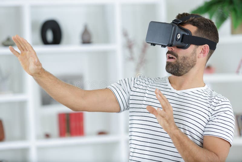 Young Man Wearing Vr Headset and Experiencing Virtual Reality Stock ...