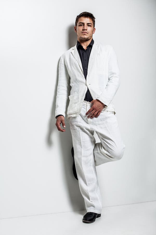 Young Man Wearing White Suit Stock Photo - Image of male, human: 35724354