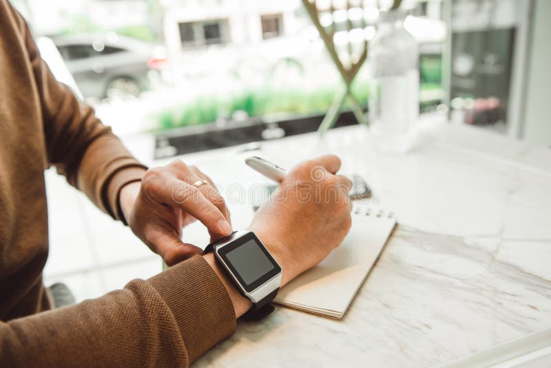 Young Man Wears Smart Watch Working on Table Stock Image - Image of ...