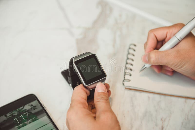 Young Man Wears Smart Watch Working on Table Stock Image - Image of ...