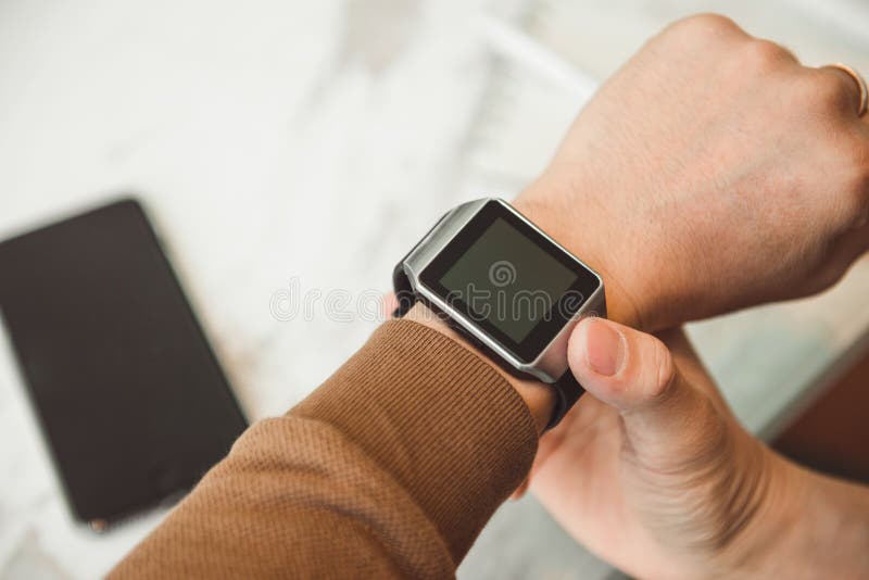 Young Man Wears Smart Watch Working on Table Stock Image - Image of ...