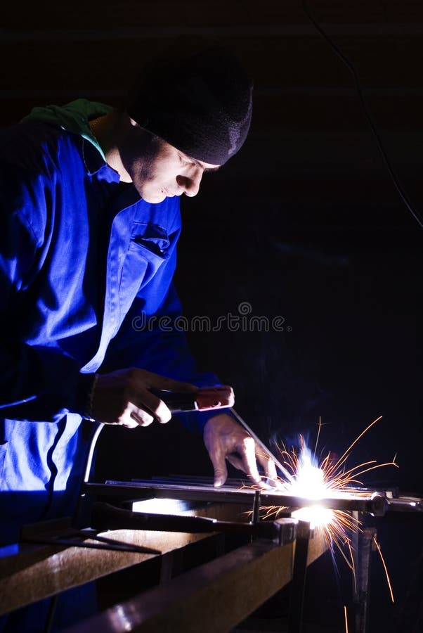 Man welding with mask stock photo. Image of industrial - 9420062