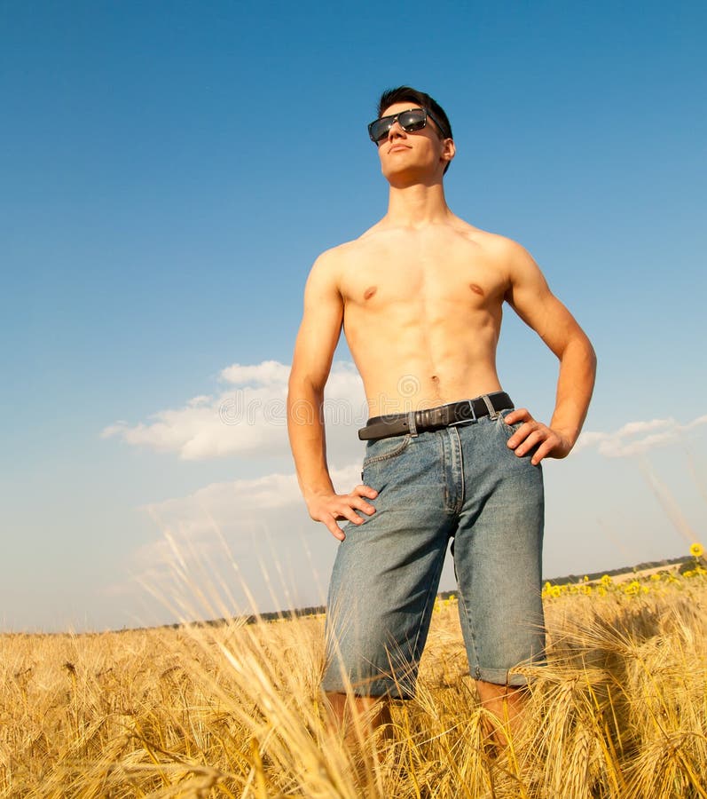 Young man on wheat field stock photo. Image of caucasian - 39511910
