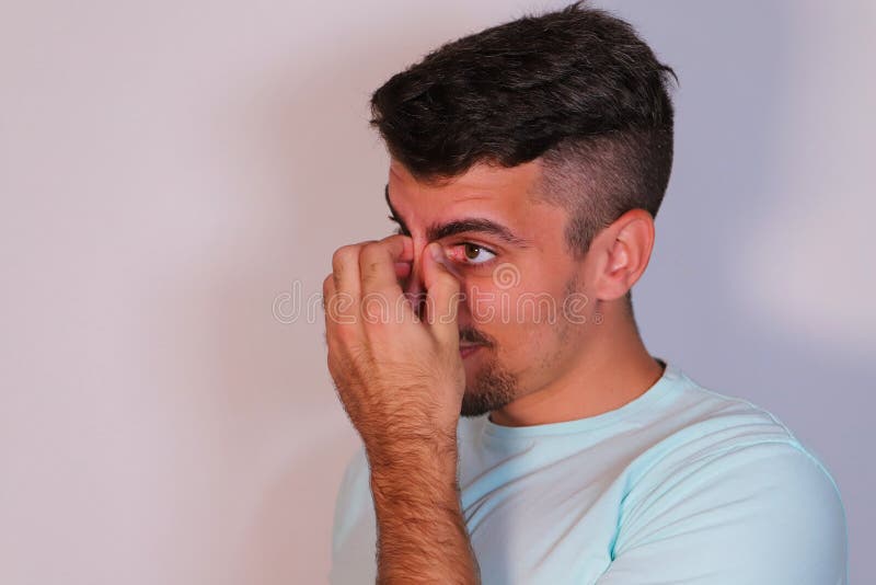 Young Man on White Background Looking in Profile and Smiling. Concept ...