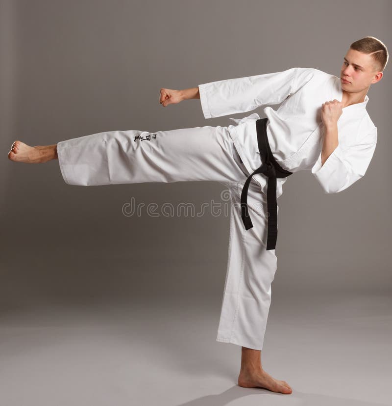 Young Man in Kimono Kicks the Leg. Stock Image - Image of activity ...
