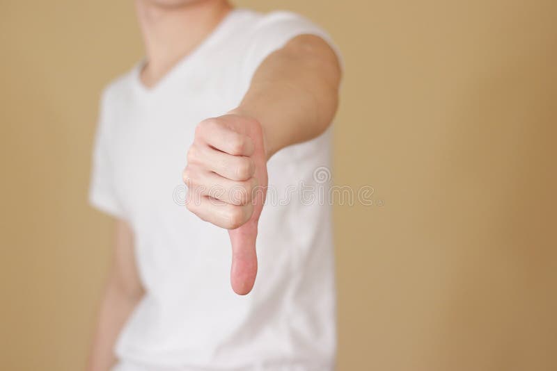Young Man Black T Shirt Showing Sign Dislike Isolated O Stock Photos ... Young Man Black T Shirt Showing Sign Dislike Isolated O Stock Photos ...