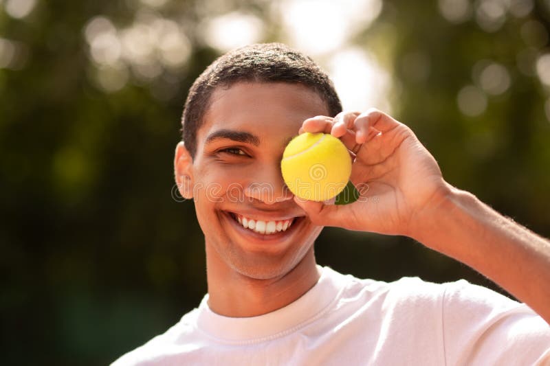 Young Man in White Tshirt with a Tennis Ball in Hands Stock Image ...