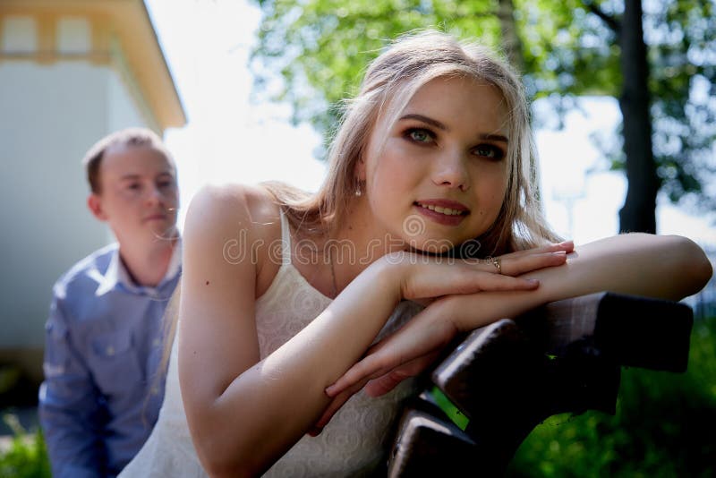 Young Man And Woman Couple Walk In The Park Spring Or Summer Love