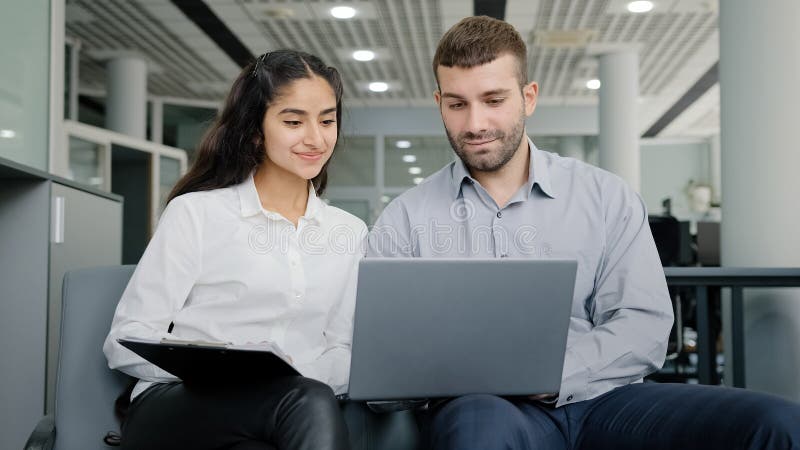 Young Man and Woman Office Workers Creative Team Colleagues Discussing ...