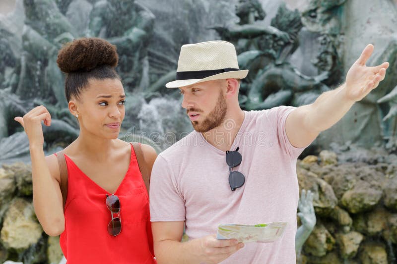 Young Man and Woman Searching Right Direction on Map Stock Image ...