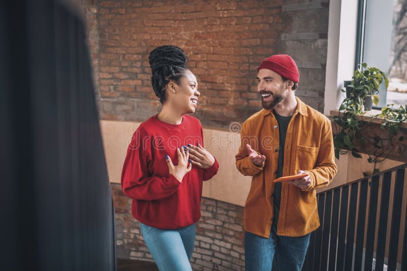Young Man and a Woman Talking and Looking Interested Stock Image ...