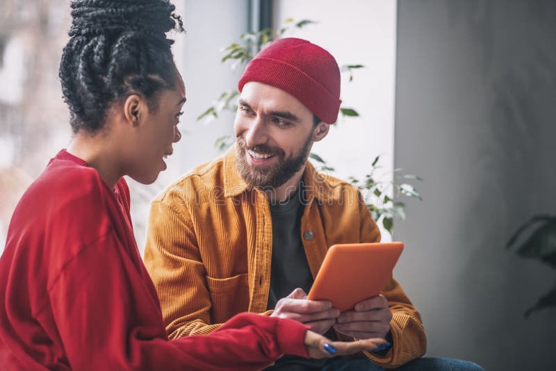 Young Man and a Woman Talking and Looking Interested Stock Image ...
