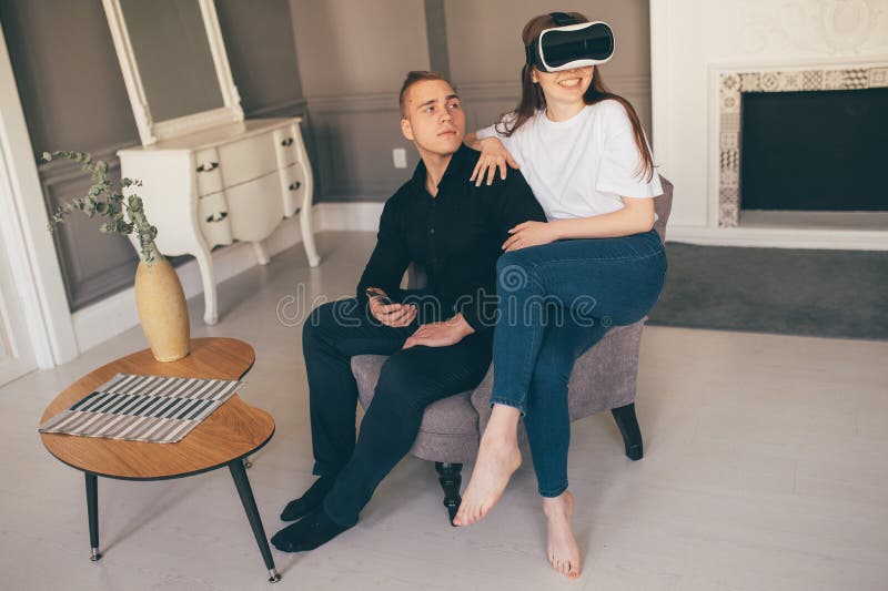 Young Man and Woman Using VR in the Living Room Stock Image - Image of ...