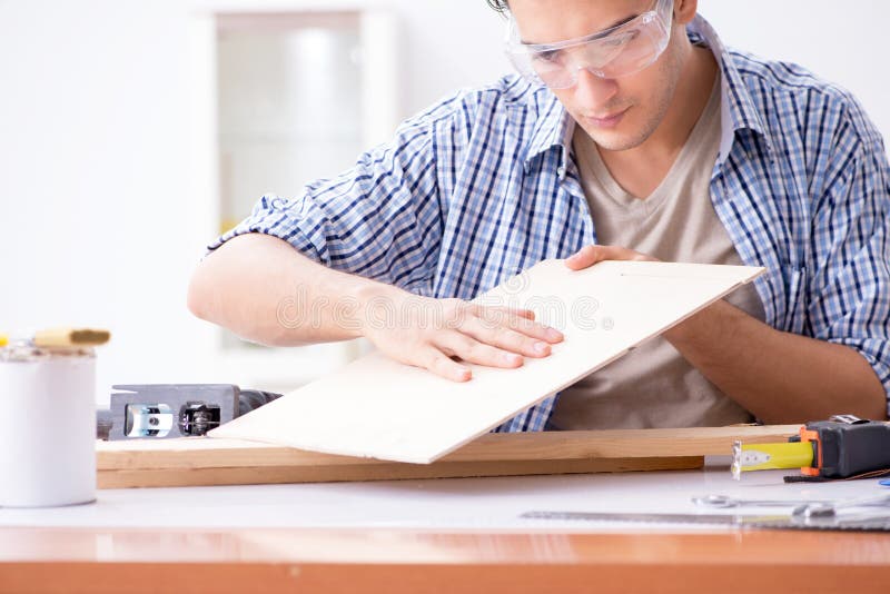 The Young Man in Woodworking Hobby Concept Stock Photo - Image of ...