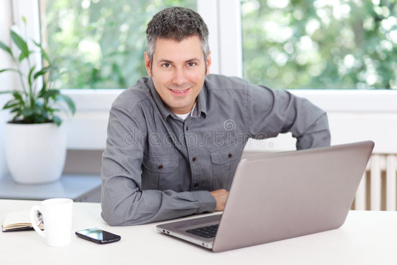 Young man at work stock image. Image of computer, businessman - 56939925