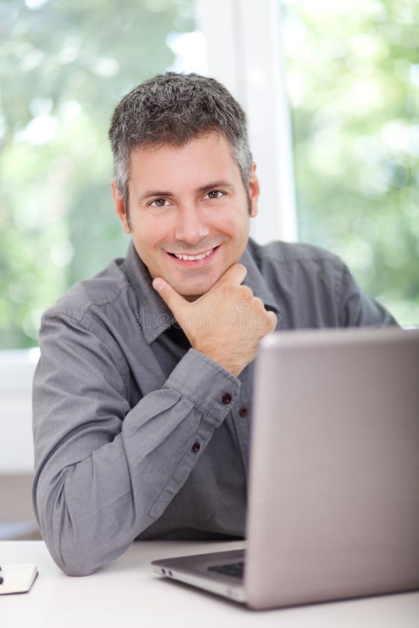 Young man at work stock image. Image of career, laptop - 56940121