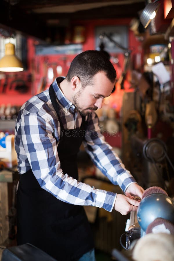 Young Man Worker Energetically Working in Leather Workshop Stock Photo ...